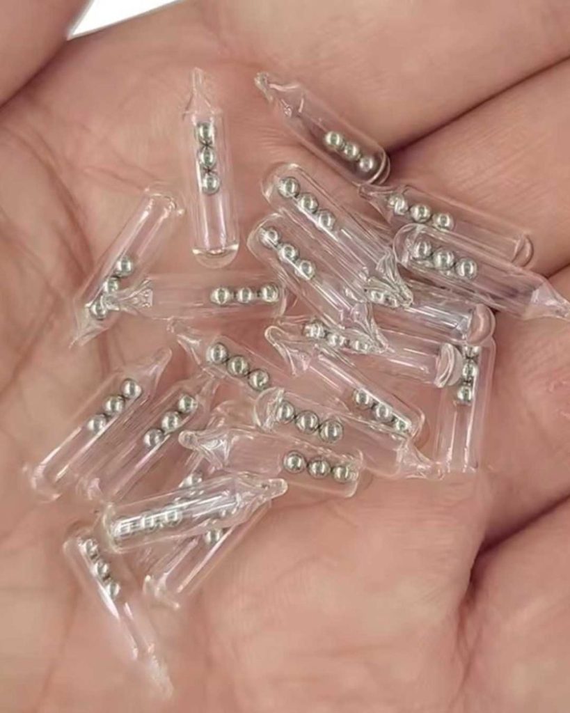 A package showed up for me: small glass tubes with 3 tiny ball bearings ...